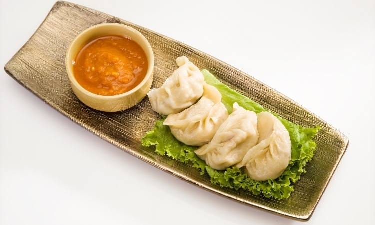 The intriguing tale of Momos immigration to India | by ...