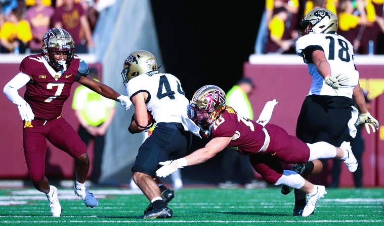 Charlie Offerdahl, a walk-on running back, receives a Colorado ...