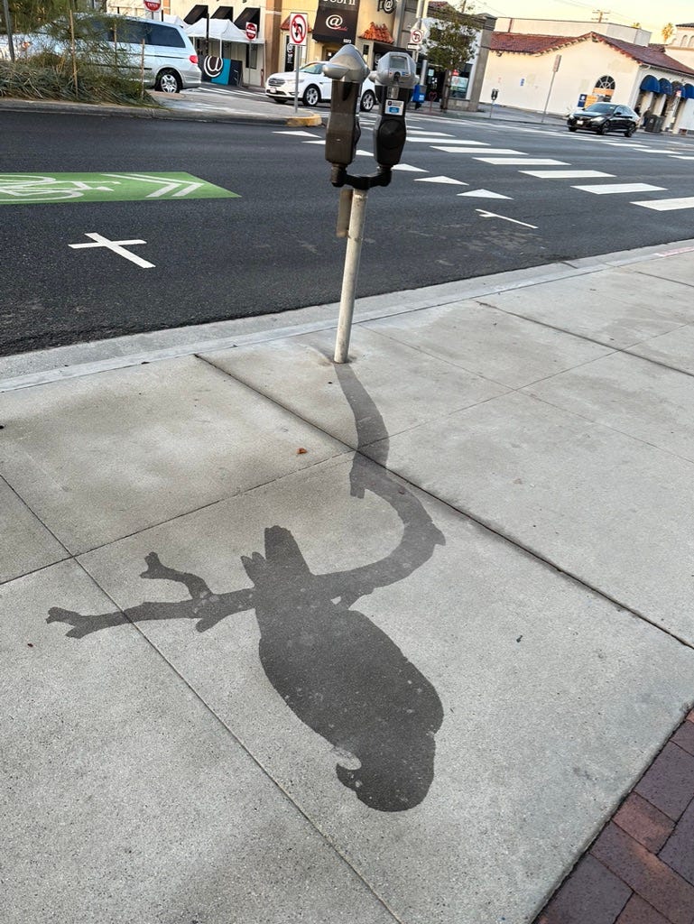 Parking Meter Shadows. Pavement art along the streets of Long… | by ...