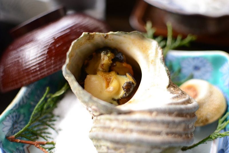 “Sazaeno-tsuboyaki” literally means “baked turban shell in a pot” | by ...